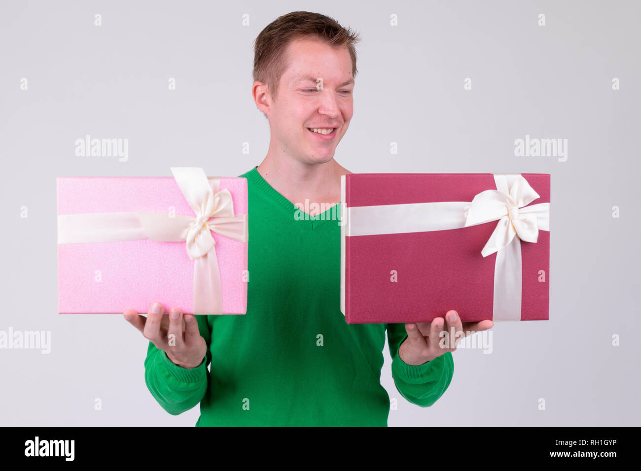 Young guy comparing two hi-res stock photography and images - Alamy