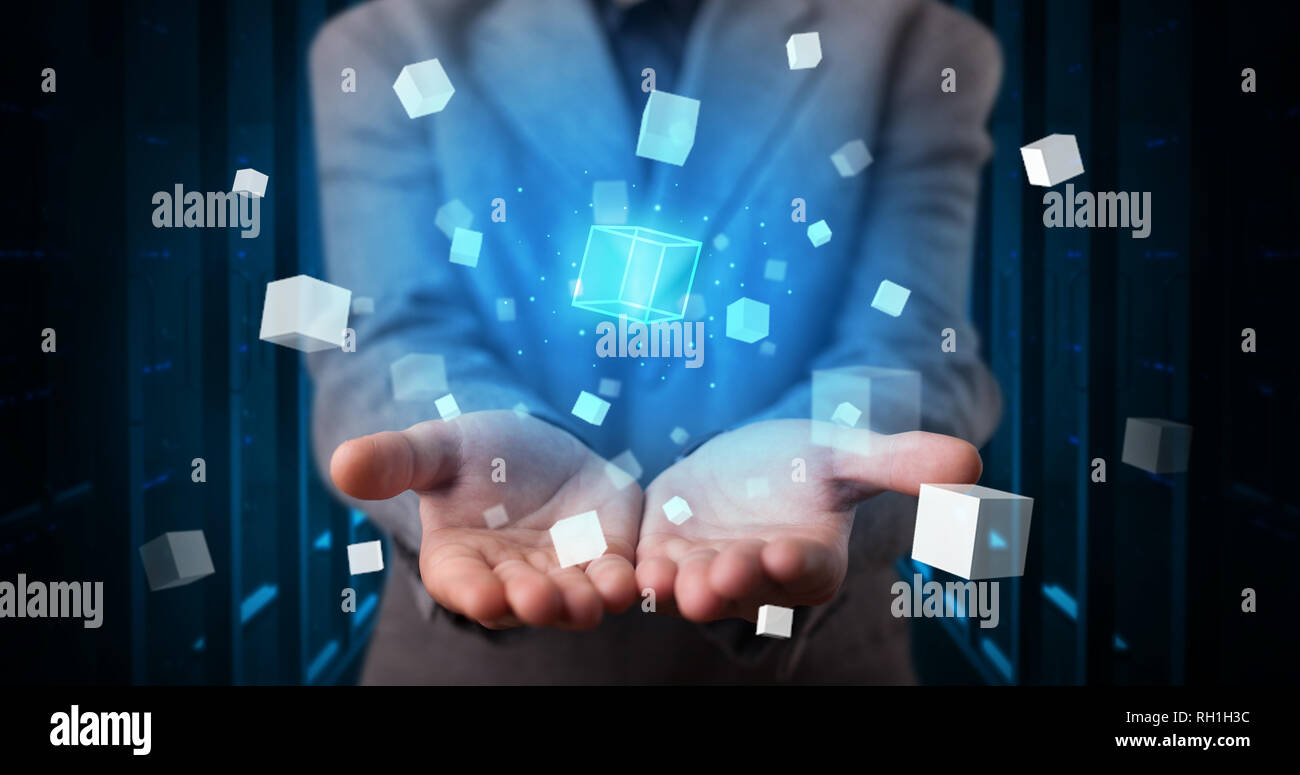 Person holding hologram projection displaying white cubes in server ...