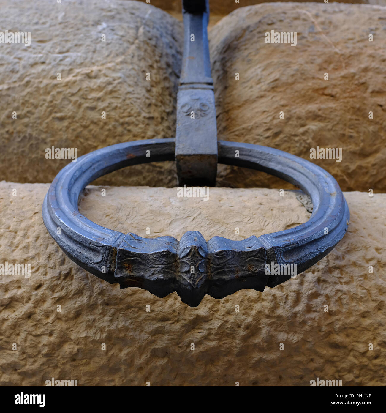 Metal Iron Horse Hitching Post against old stone walls Florence Italy ...