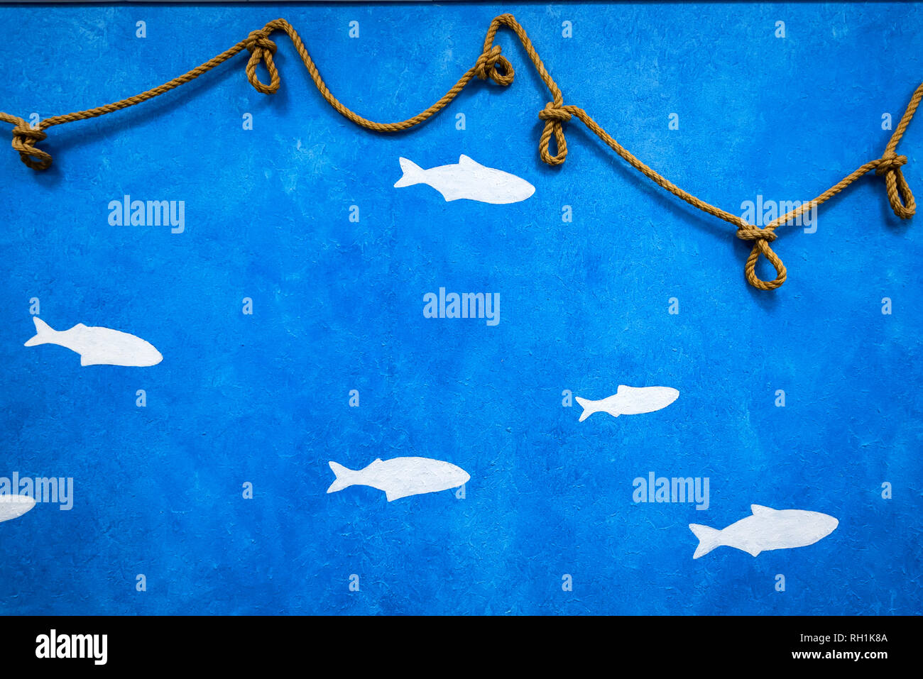Blue background with white fish silhouettes. Fishing concept Stock ...