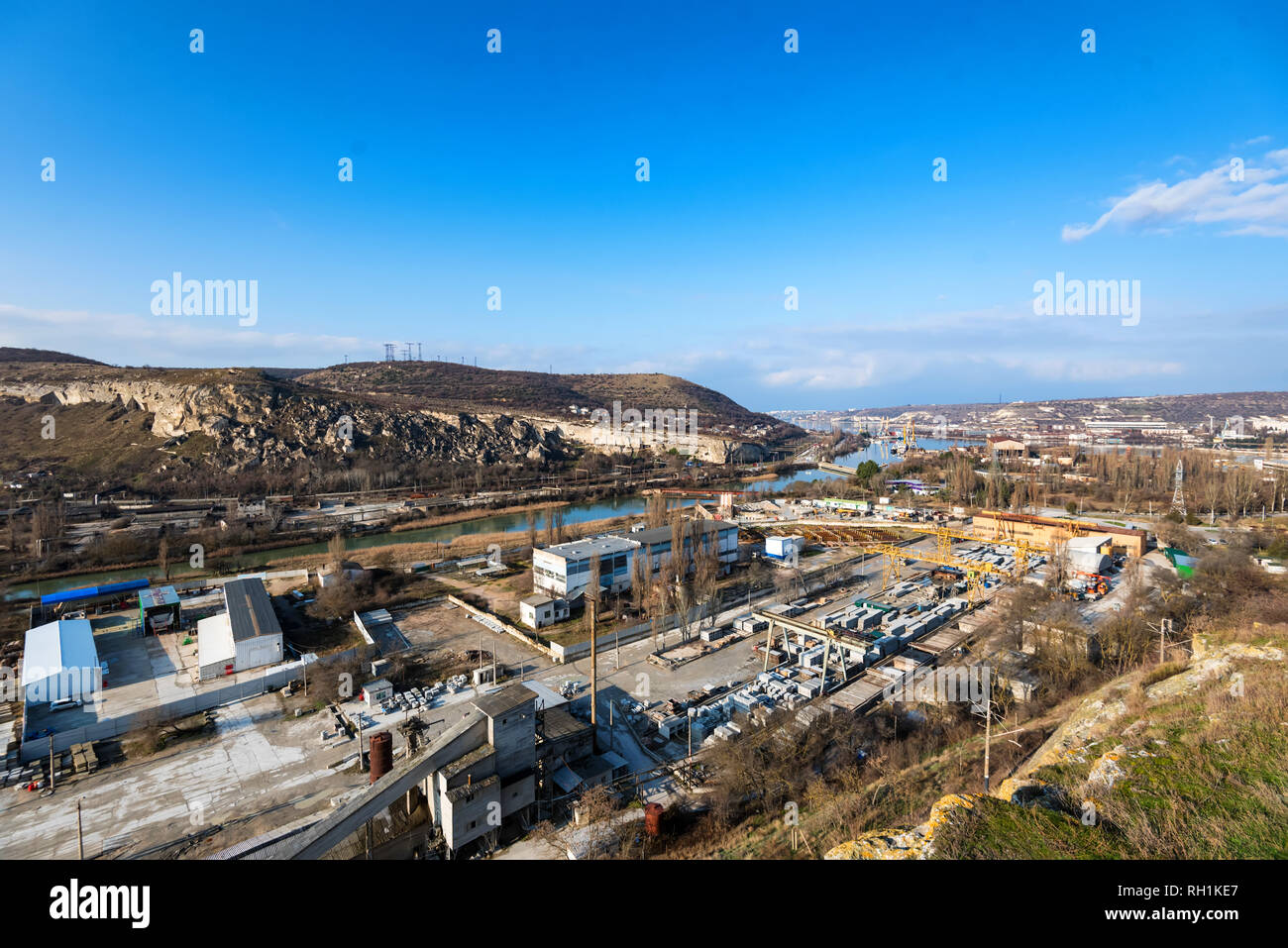 Industrial Zone Of A City Near A River With Building Equipment Stock industrial-zone-of-a-city-near-a-river-with-building-equipment-stock