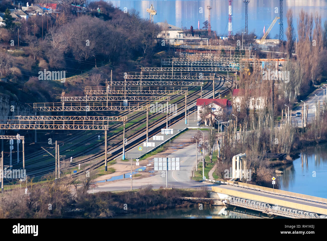 Industrial zone and railway of a city near a river with building ...