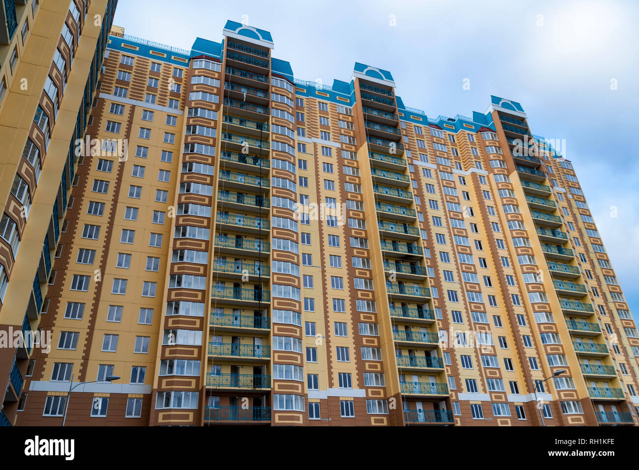 View of modern high-rise apartment building in winter Stock Photo - Alamy