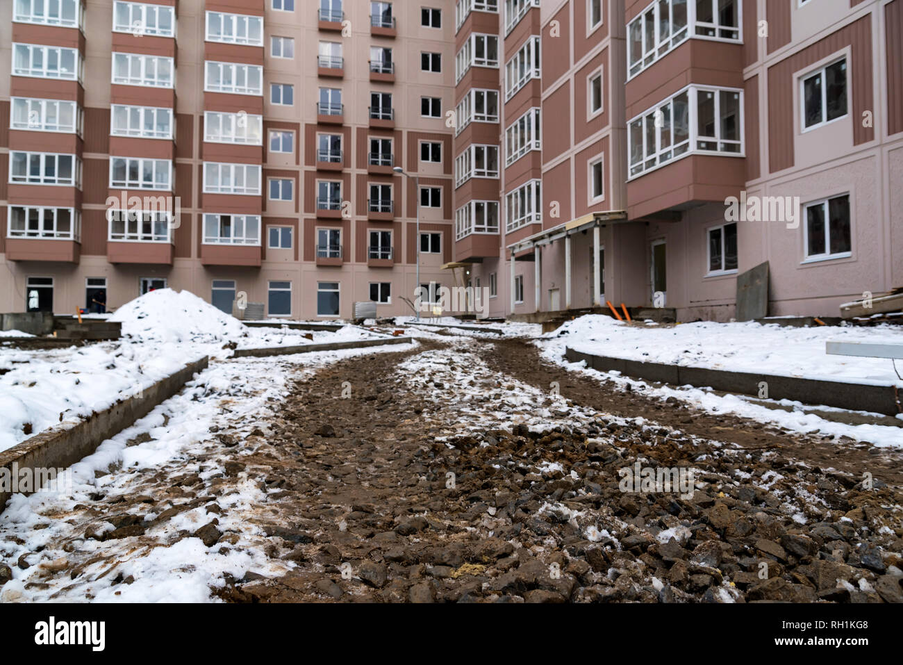 Entrance to modern high-rise apartment building in winter Stock Photo ...