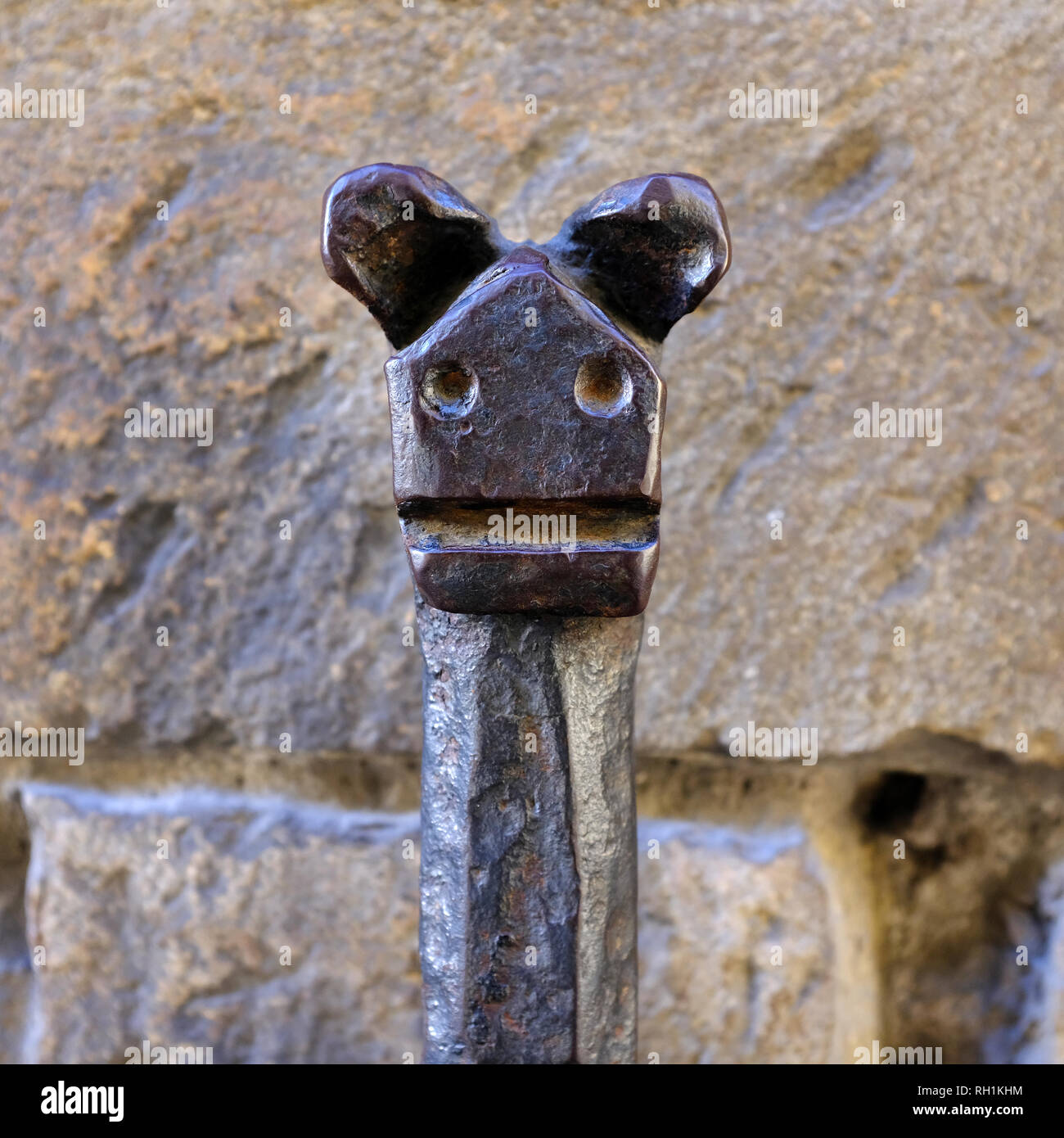 Metal Iron Horse Head Hitching Post against old stone walls Florence ...
