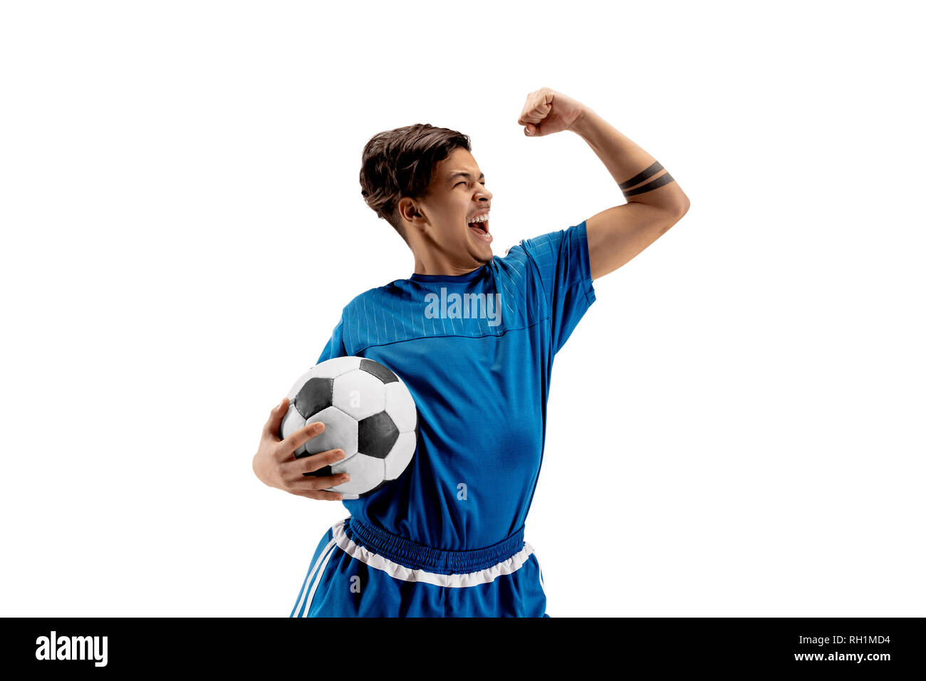 Young fit boy with soccer ball standing isolated on white as winner ...