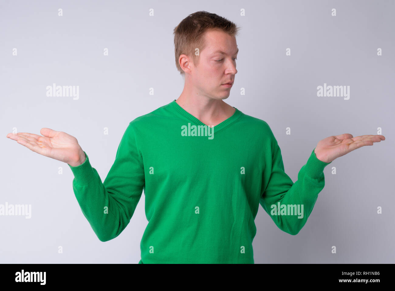 Young guy comparing two hi-res stock photography and images - Alamy