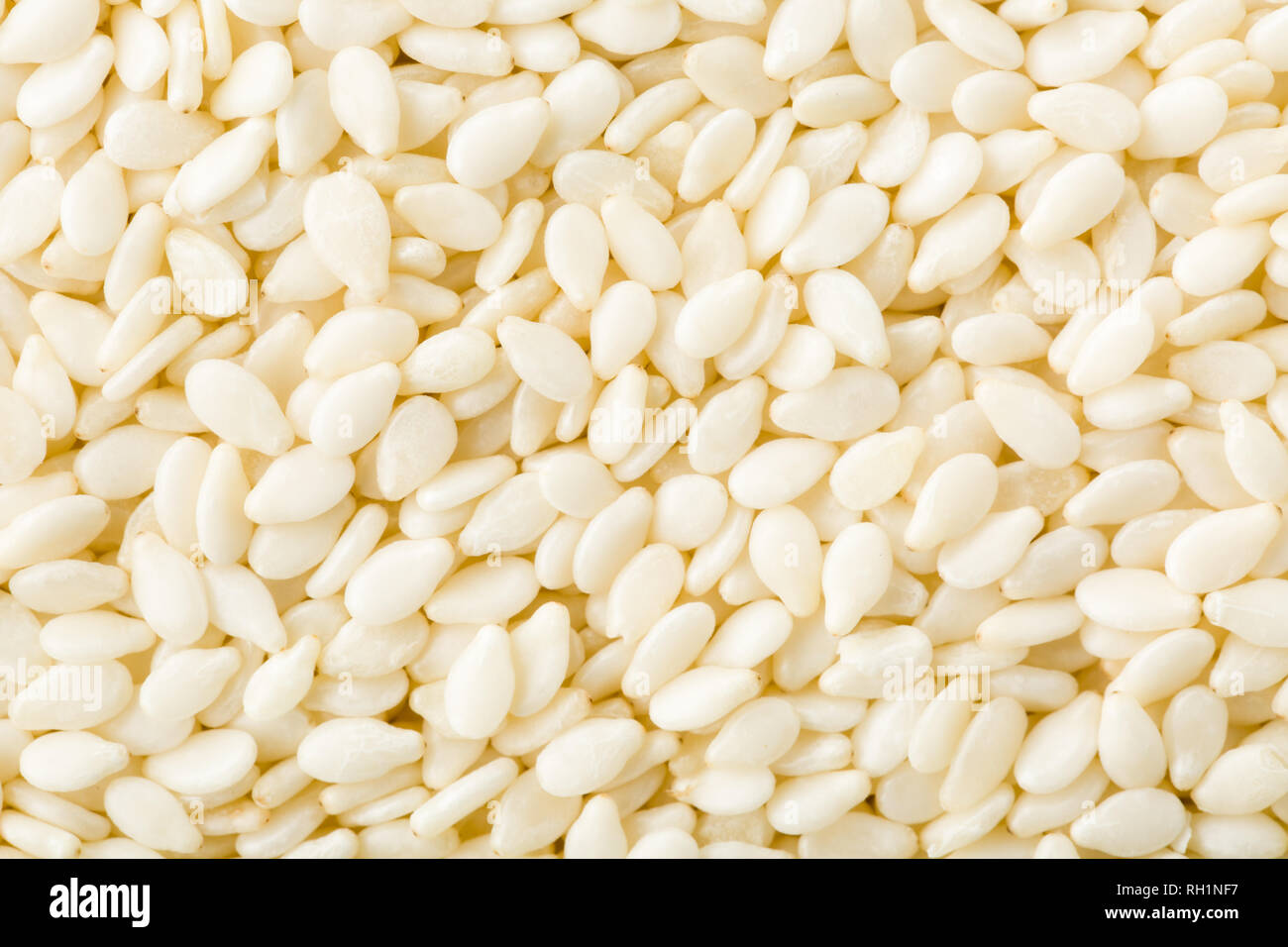 White peeled sesame seeds close up, background, texture, top view Stock ...