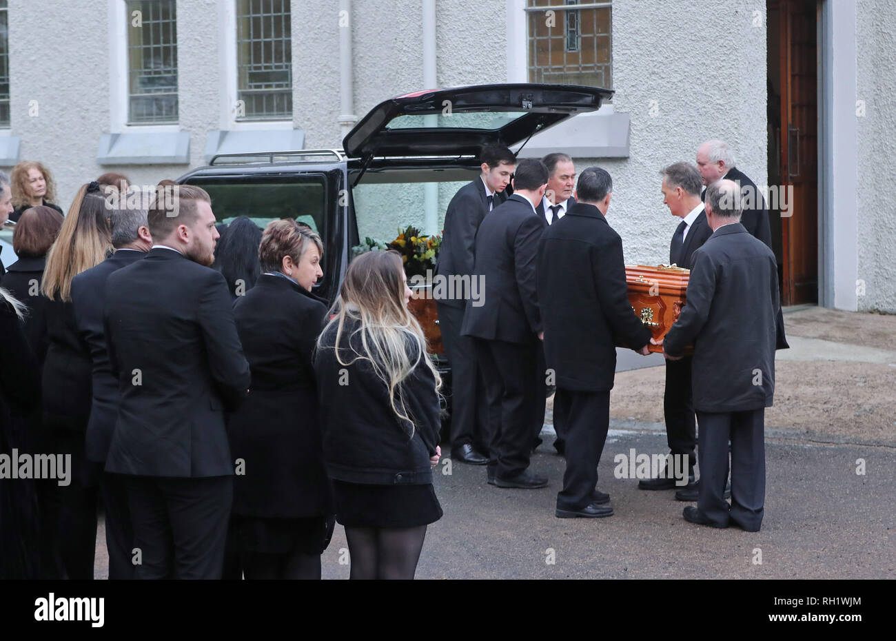 The coffin of Shaun Harkin is carried into Christ the King Church in ...