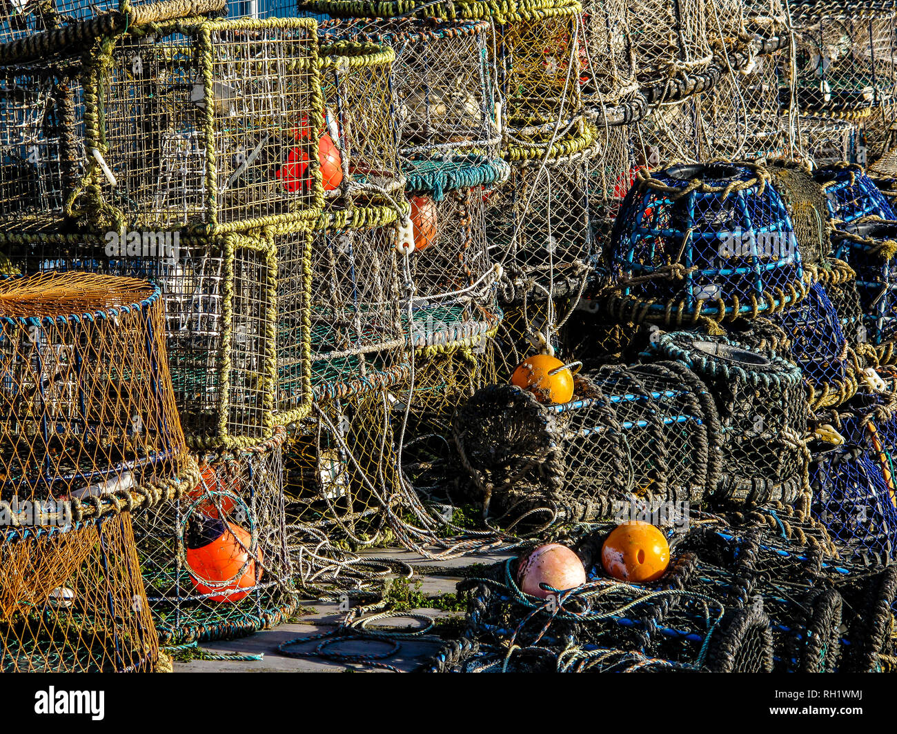 Stack of Lobster, Crab Pots, and cages , Ropes and Bouys on Fishing ...