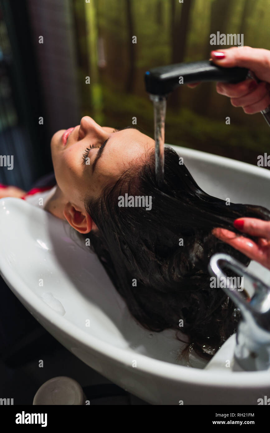 Lady washing hair shower hi-res stock photography and images - Alamy