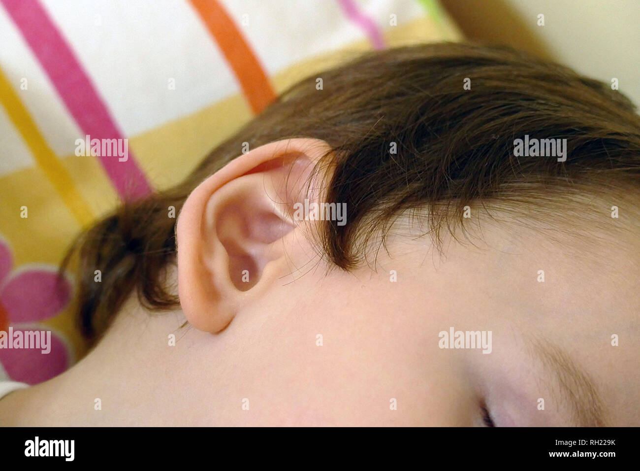 and the ear of a sleeping child, close-up pictures of ear, ear health ...