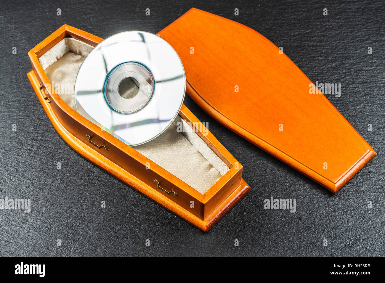 Mini compact disc or pocket compact disc in coffin.Concept Stock Photo ...