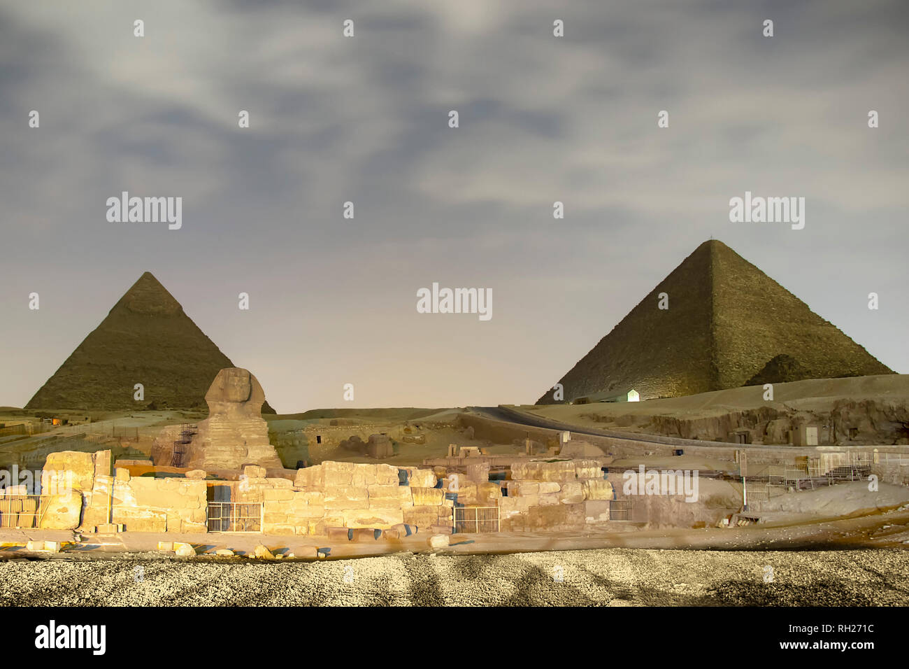 Giza pyramids and Sphinx light up at night Stock Photo - Alamy