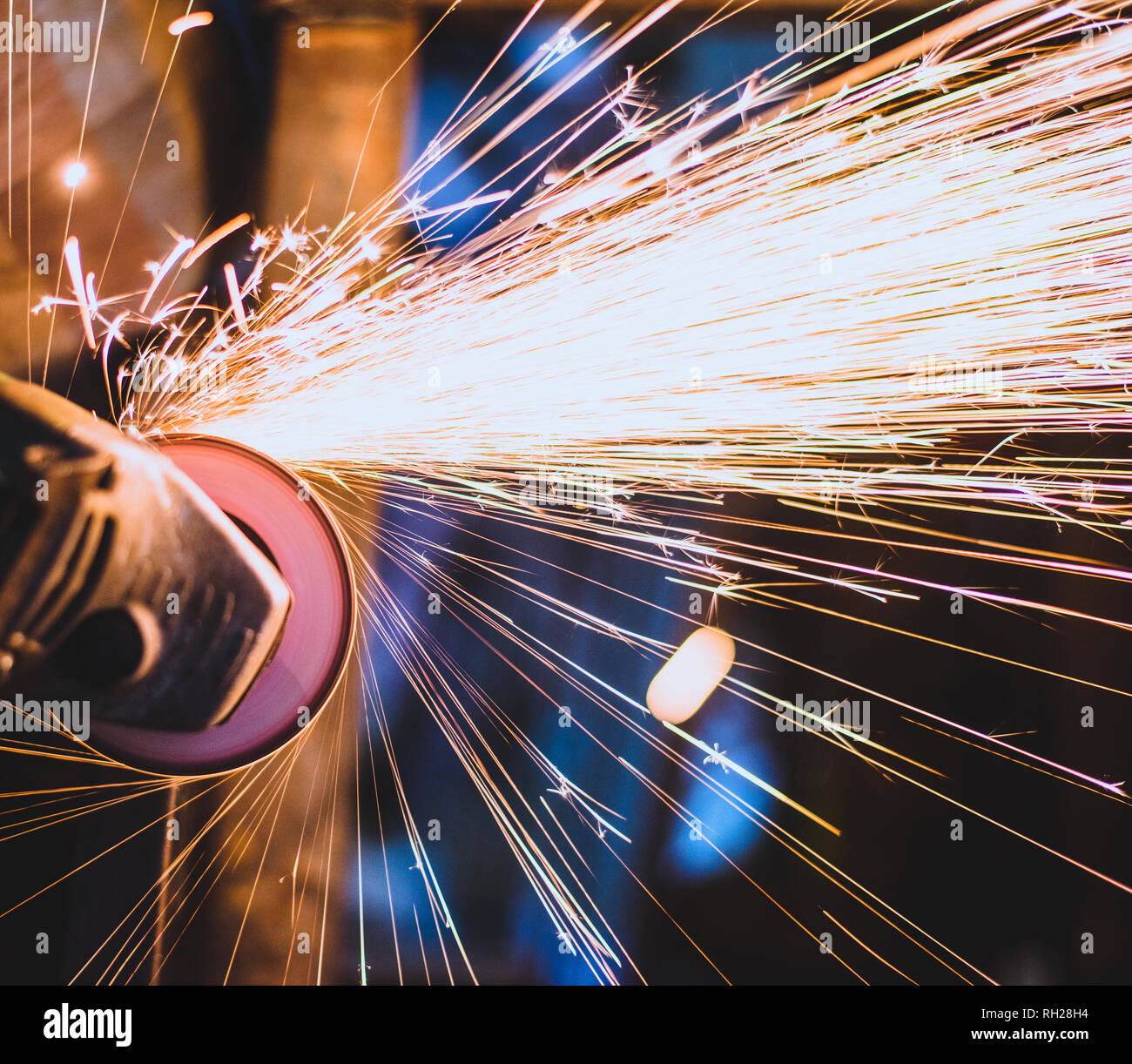 Welder grinder metal with electric grinder Stock Photo - Alamy
