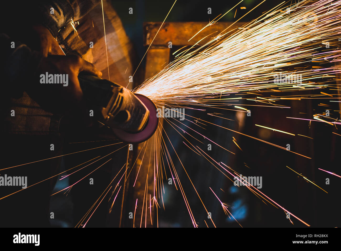 Welder grinder metal with electric grinder Stock Photo - Alamy