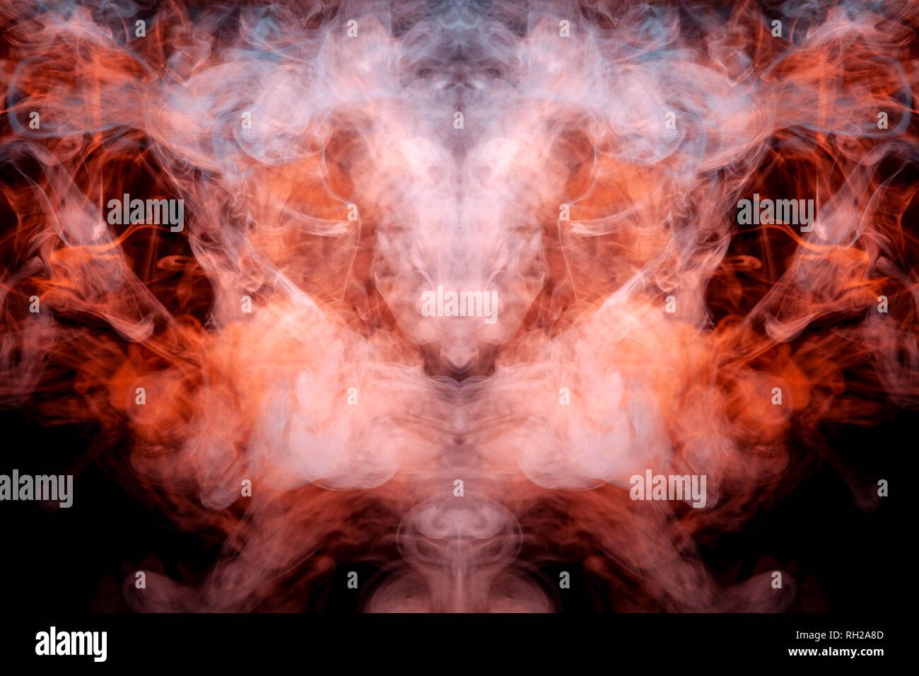 A mystical pattern of colored smoke of red and white in the shape of a ...