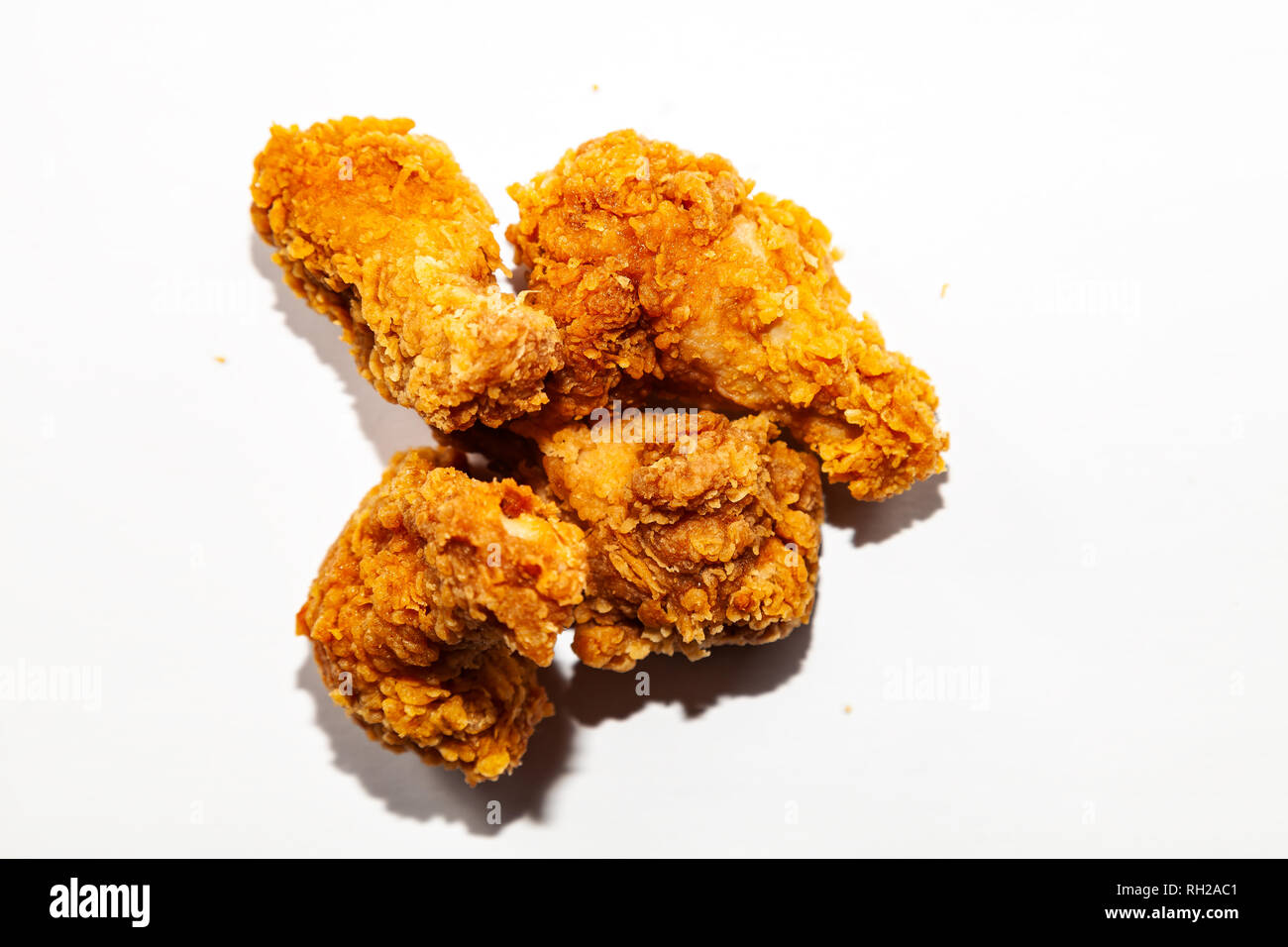 Appetizing fast food - fried chicken wings in spicy sauce and breading ...