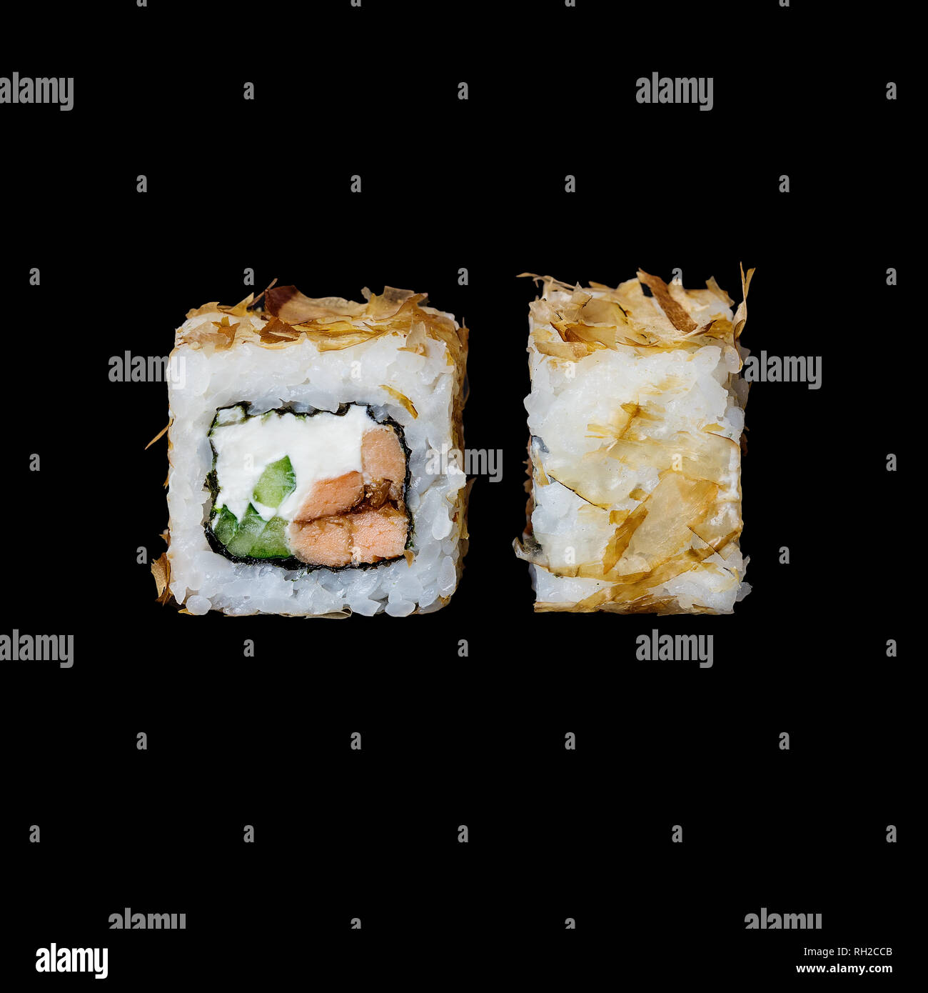 Sushi. Bonito roll with baked salmon in teriyaki sauce, cucumber, cream ...