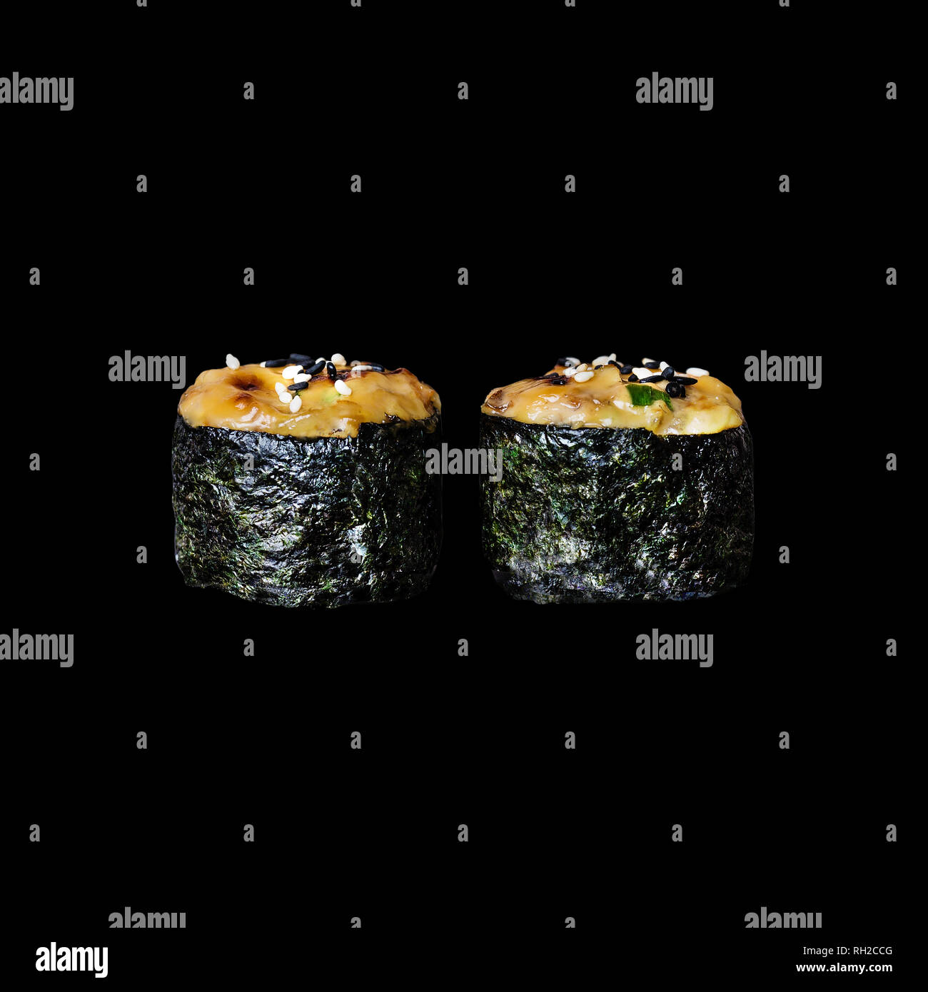 Sushi. Gunkan rolls with eel, isolated in black background Stock Photo ...