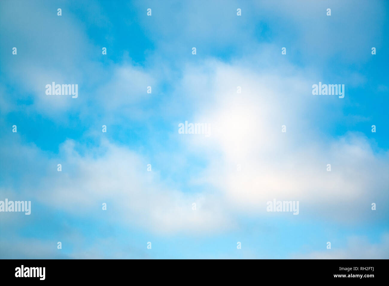 Huge clouds in blue sky lit by the sun, not windy Stock Photo - Alamy