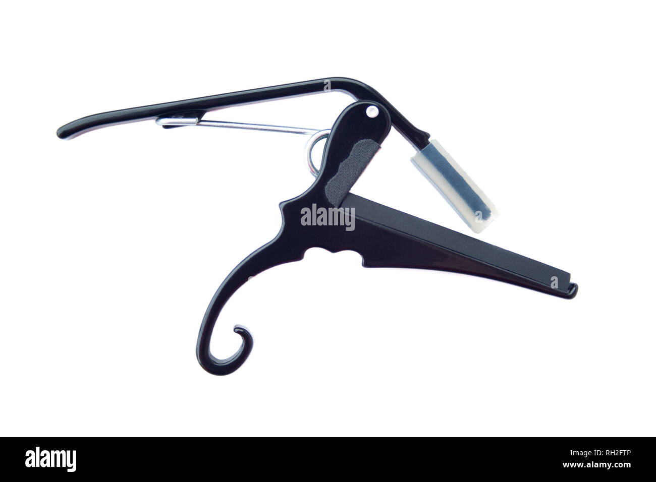 Black capo isolated on white background top view. Music equipment ...