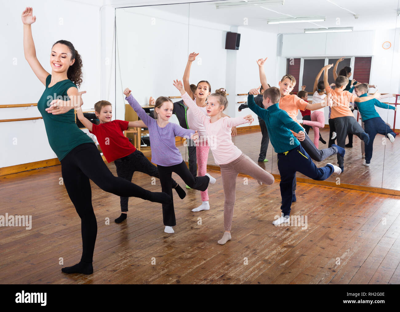 Happy children studying contemp dance in dancing studio Stock Photo - Alamy