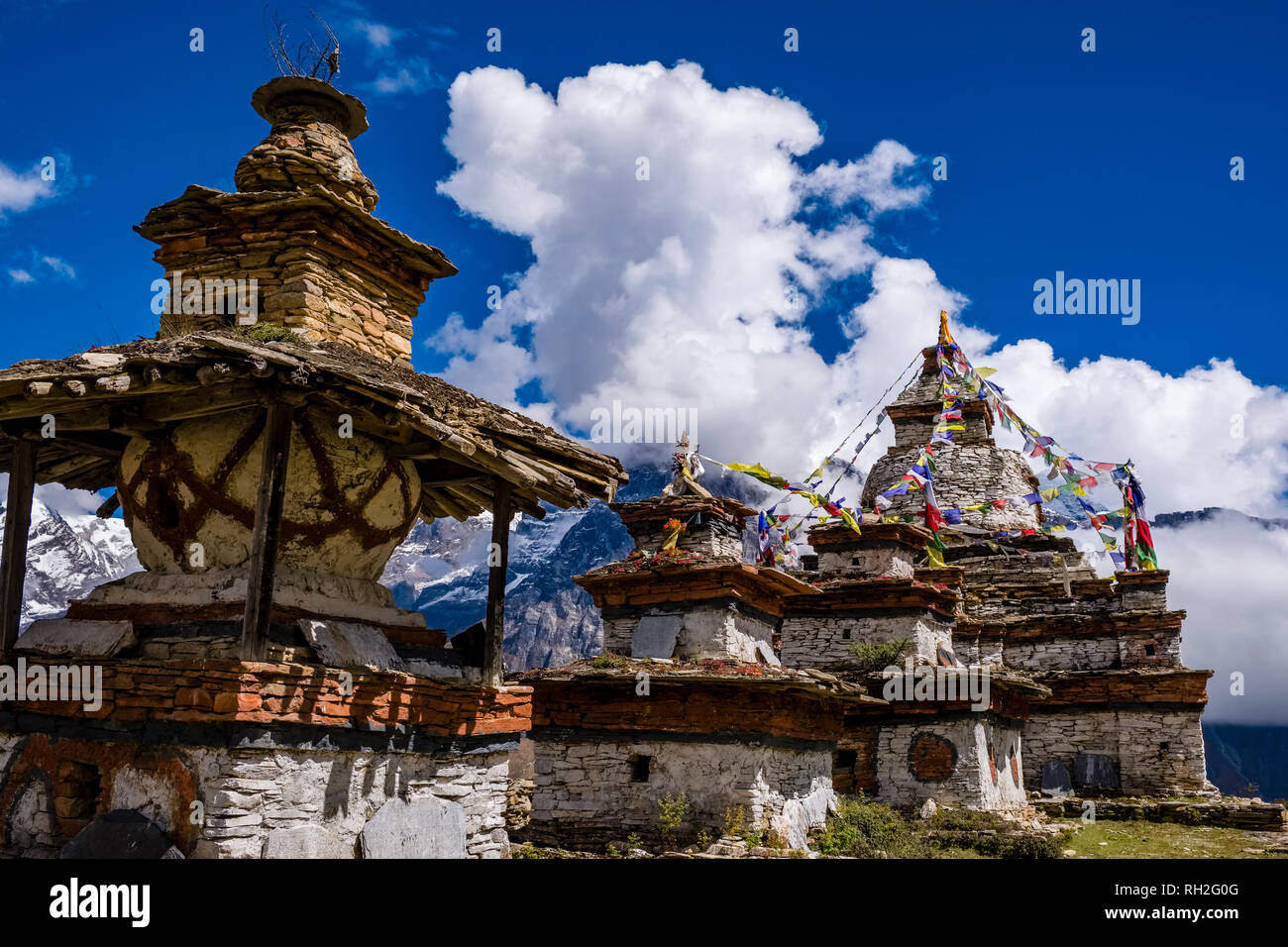 A group of chorten, stupas, is located at the entrance of the village ...