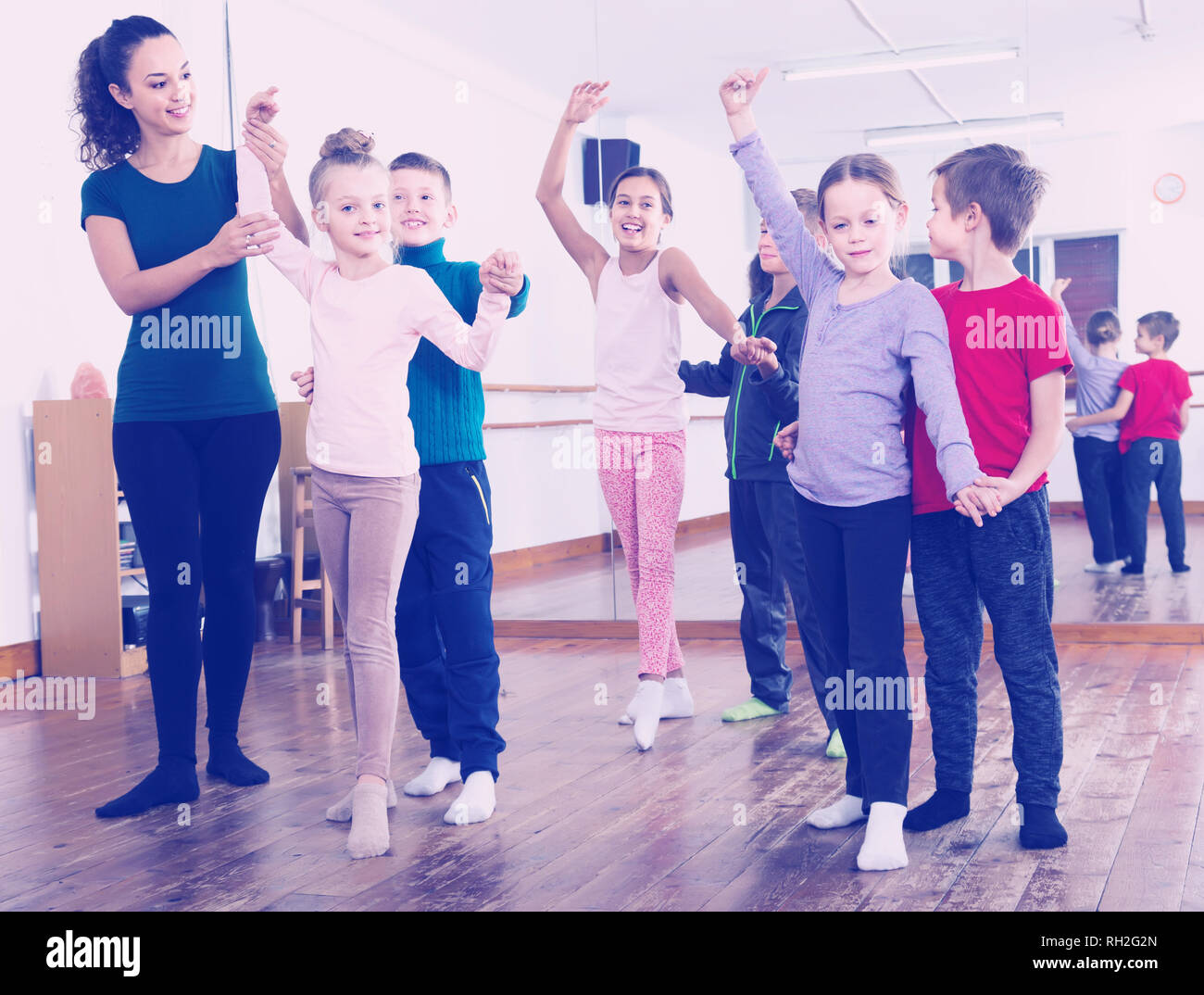 primary school age boys and girls dancing pair dance in the ballet ...