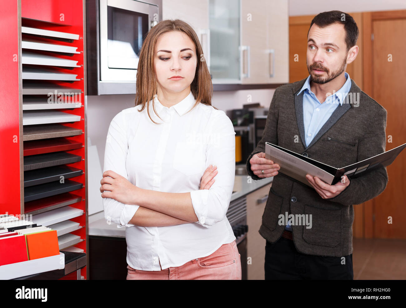 Male shop assistant unhappy hi-res stock photography and images - Alamy