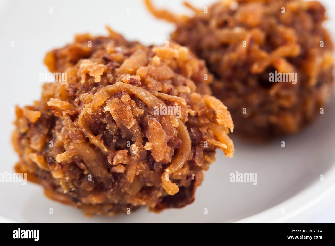 Colombian traditional coconut sweet called cocada in a white ceramic ...