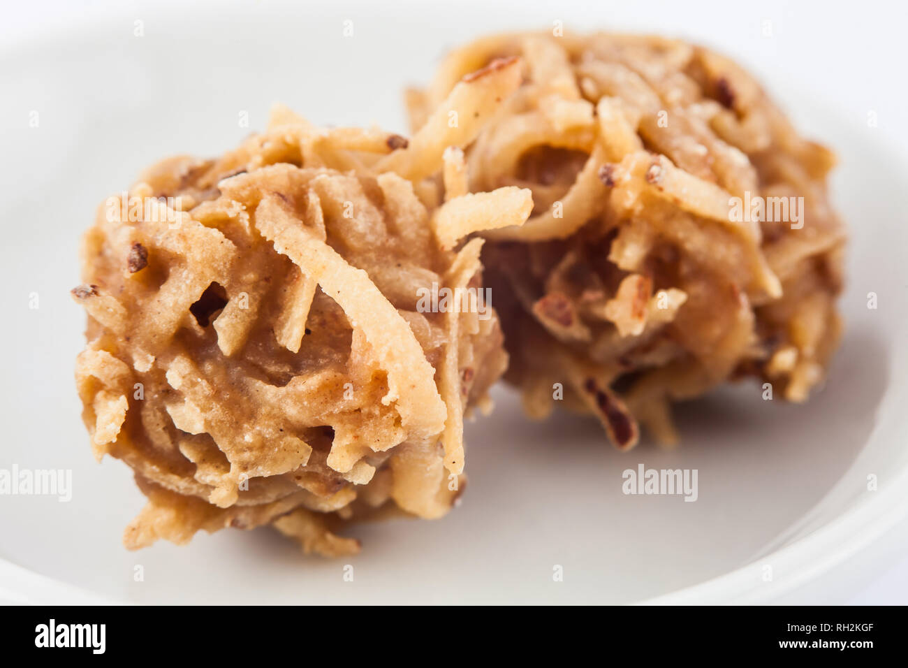 Colombian traditional coconut sweet called cocada in a white ceramic ...