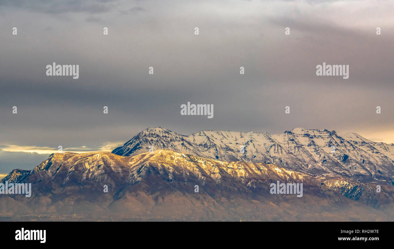 Snow capped Mount Timpanogos lit by sunlight Stock Photo - Alamy