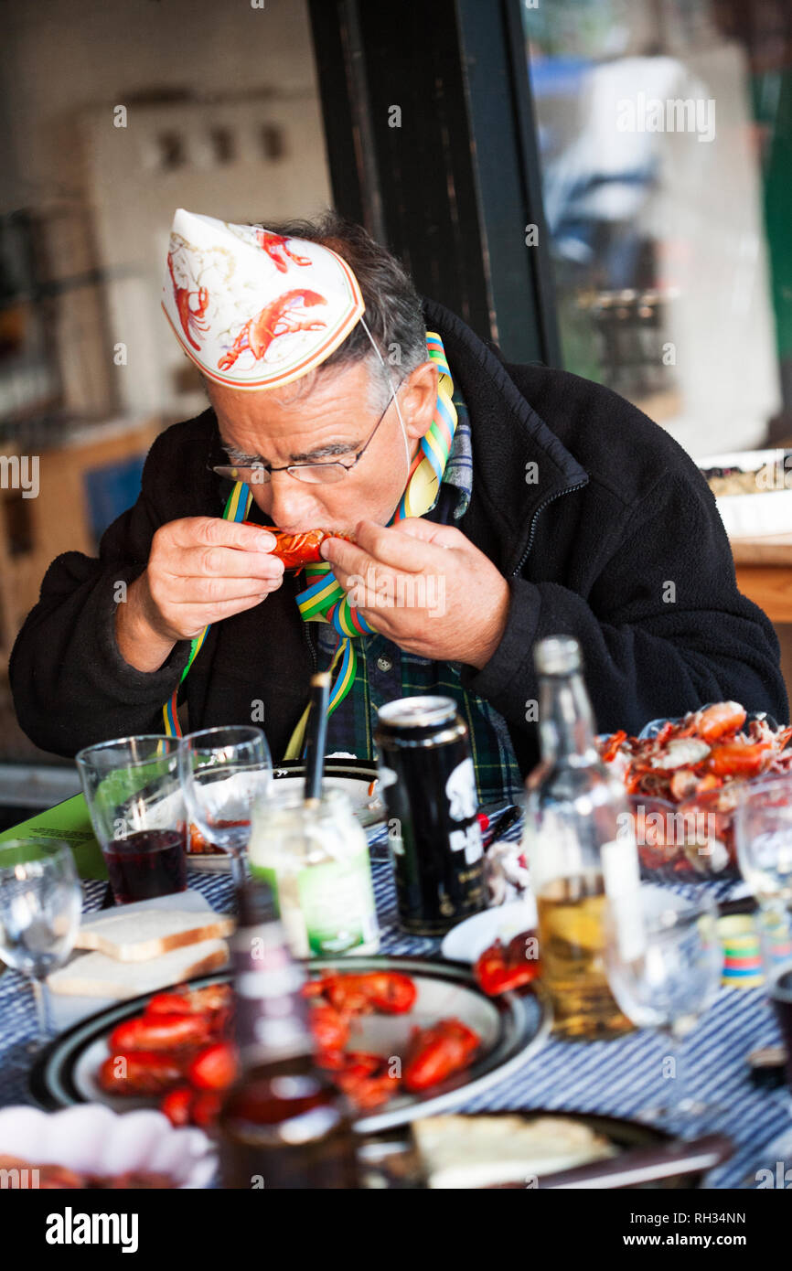 Man eating crayfish Stock Photo - Alamy