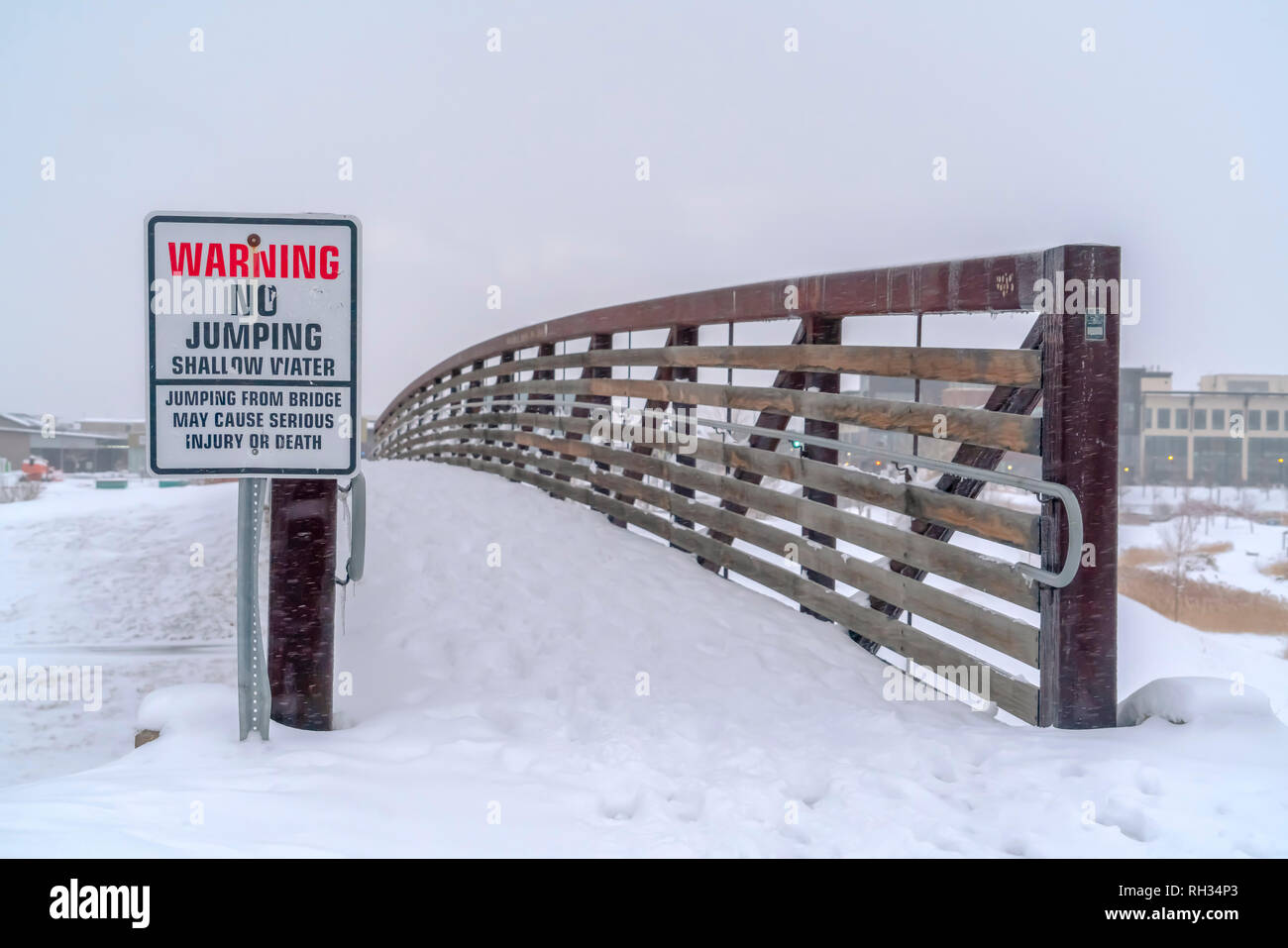 Warning sign on a snowy bridge in Daybreak Utah Stock Photo - Alamy