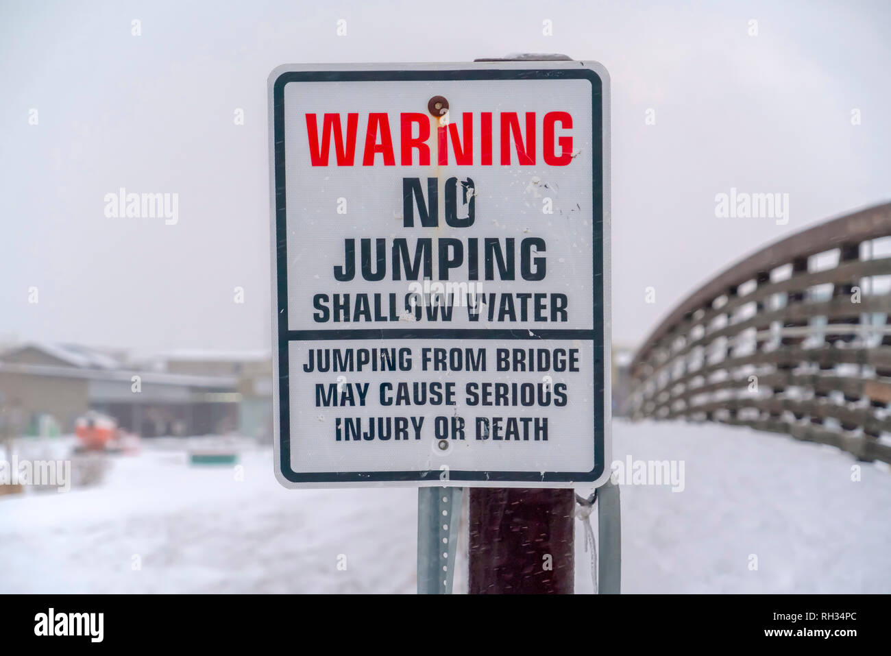 Warning sign on bridge over lake in Daybreak Utah Stock Photo - Alamy