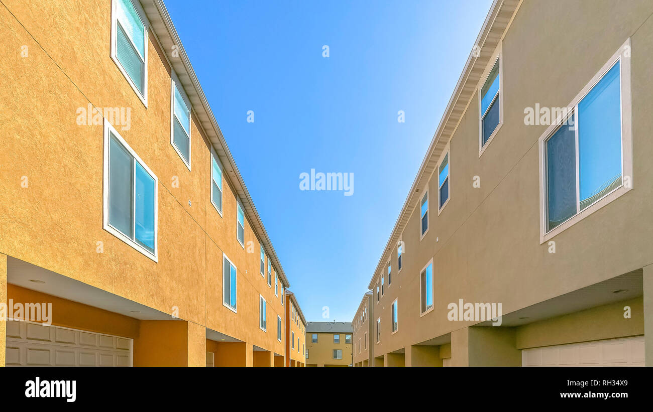 Windows and garage doors at the back of a building Stock Photo - Alamy