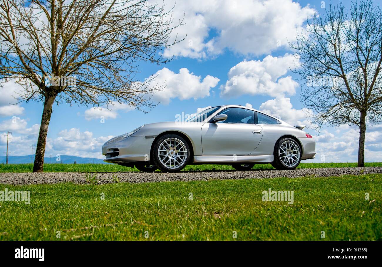 April 2, 2018 Eugene Oregon - A silver Porsche 911 body style 996 sits ...