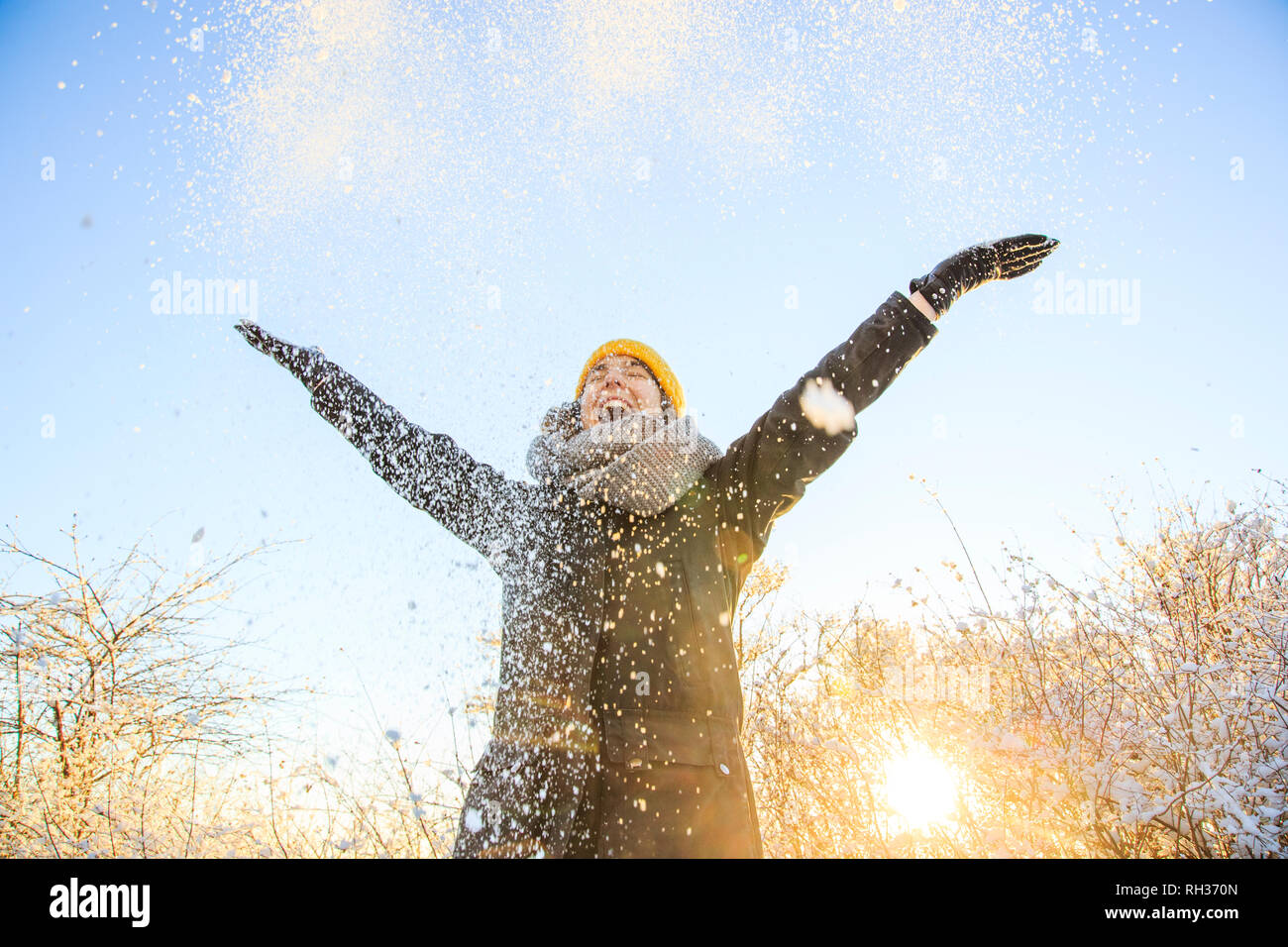 Woman throwing snow hi-res stock photography and images - Alamy