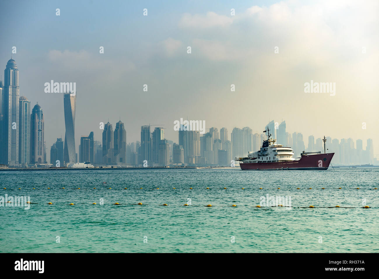 Ship on sea, skyline on background Stock Photo - Alamy