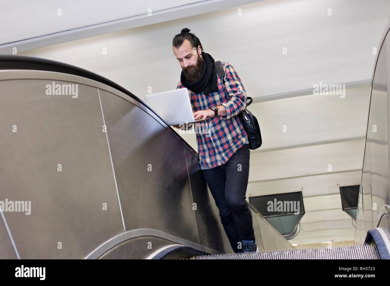 Portrait of mature man on escalator Stock Photo - Alamy