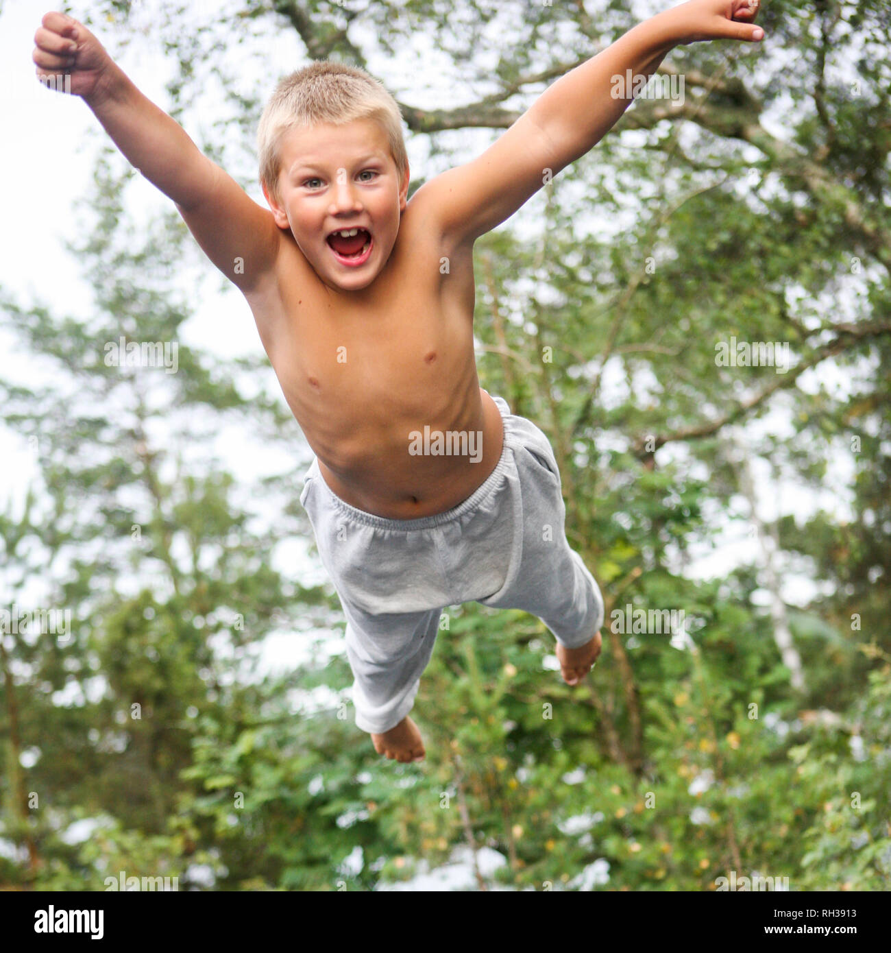 Boy jumping hi-res stock photography and images - Alamy