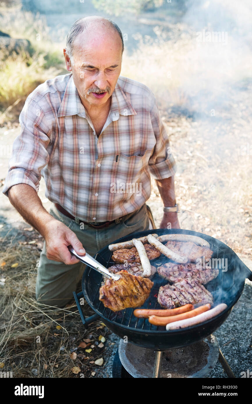 Barbecue man sausage hi-res stock photography and images - Alamy