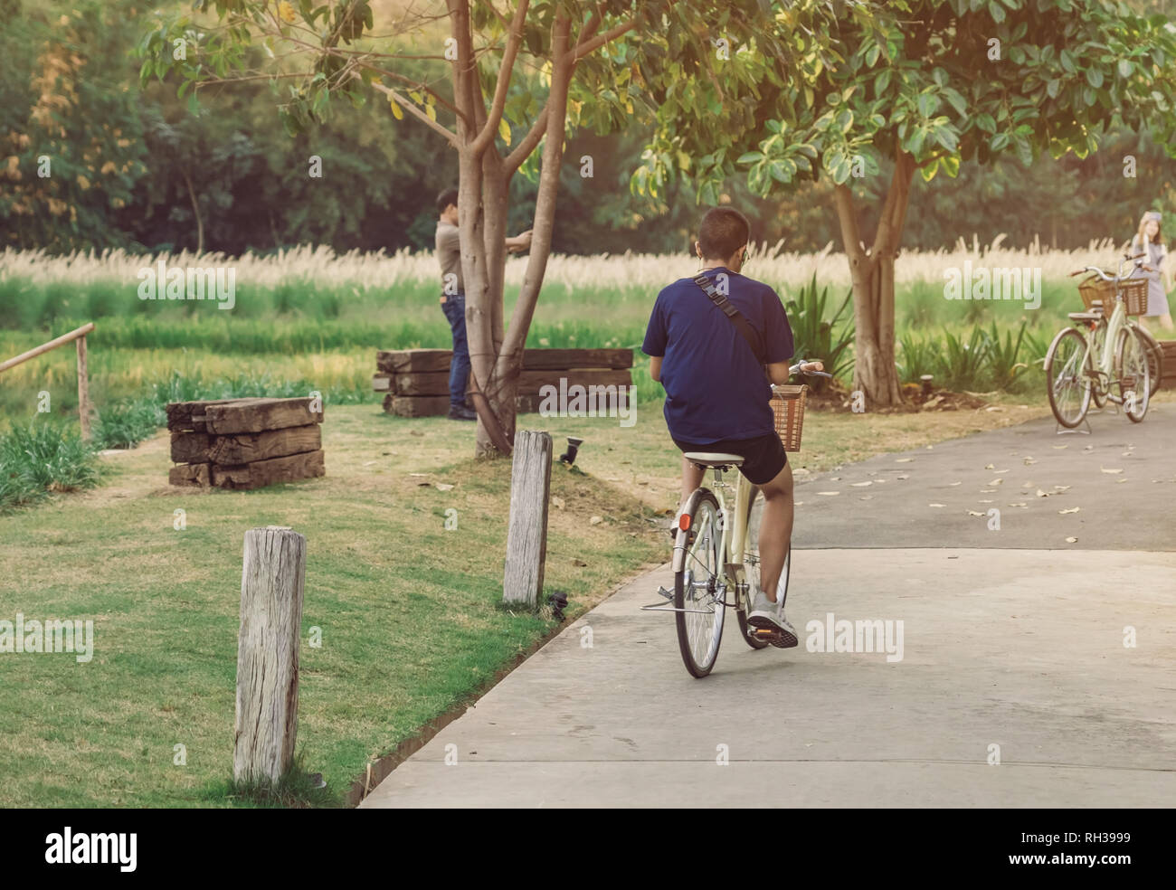 Elderly man riding bicycle bike ride exercise park cycle hi-res stock ...