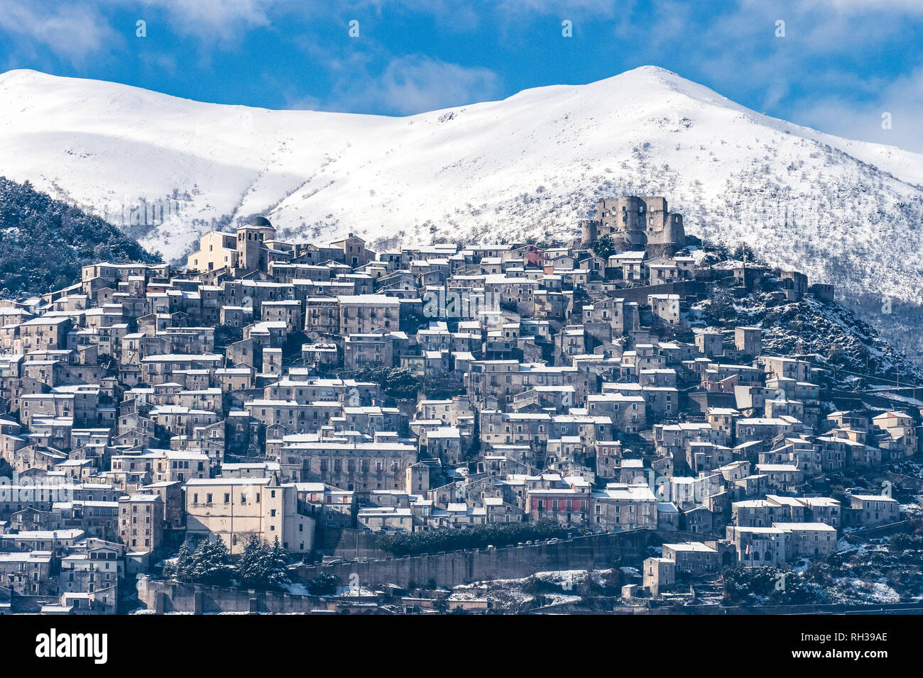 A panoramic view of Morano covered with snow on Mount Pollino in ...
