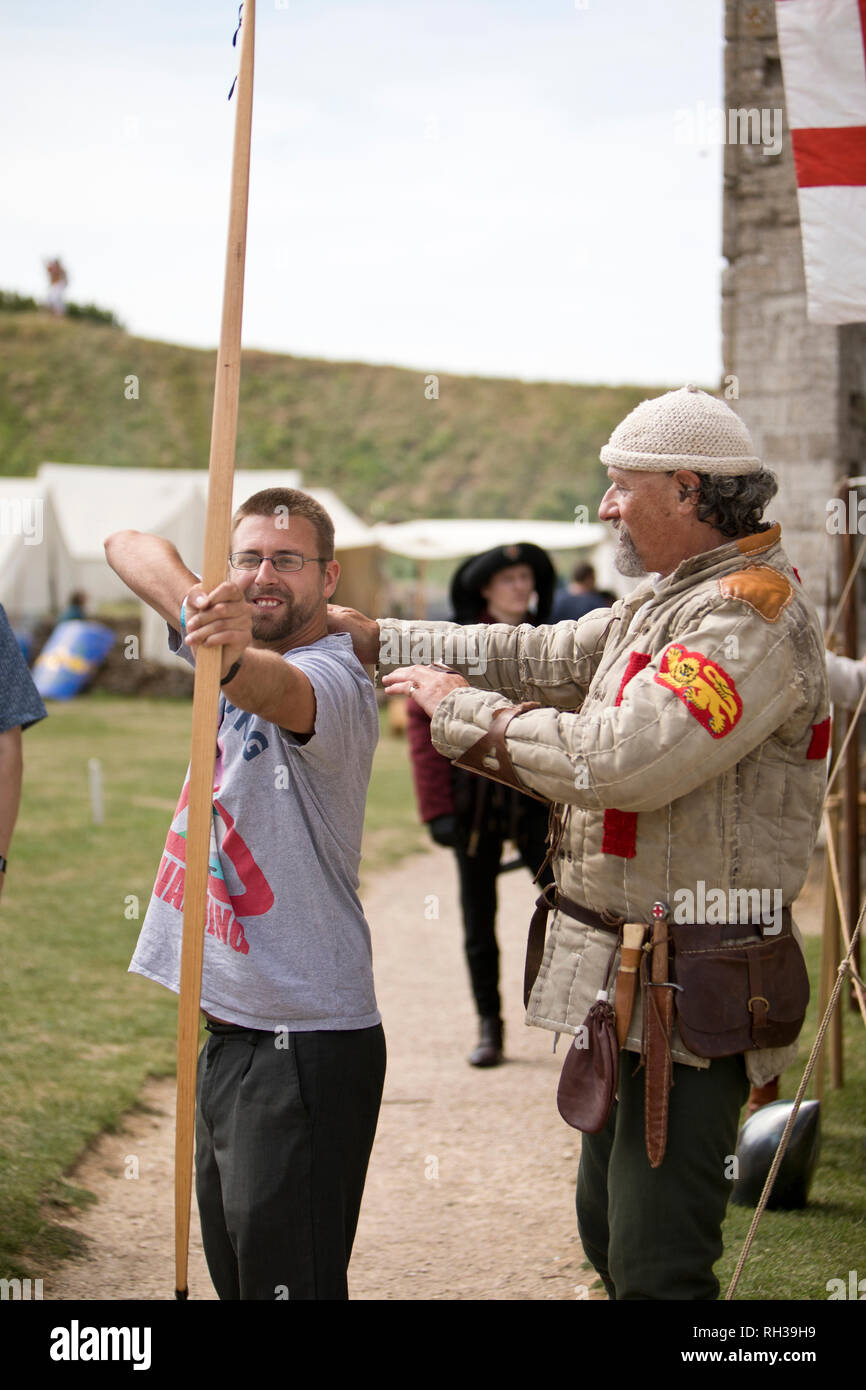 Visitor to military history event samples an authentic English longbow ...