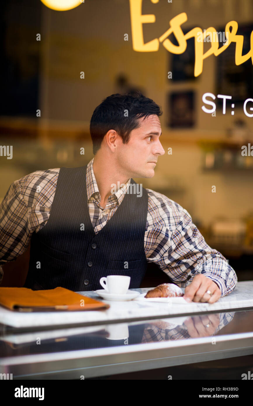 Elegant man in cafe Stock Photo - Alamy
