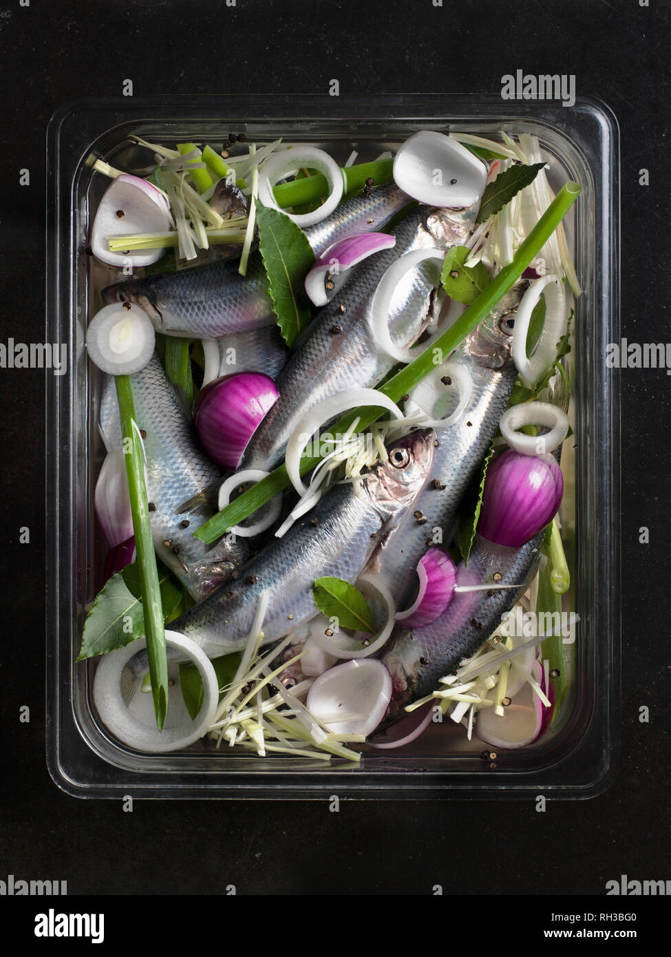 Fish and vegetables in baking tray Stock Photo - Alamy