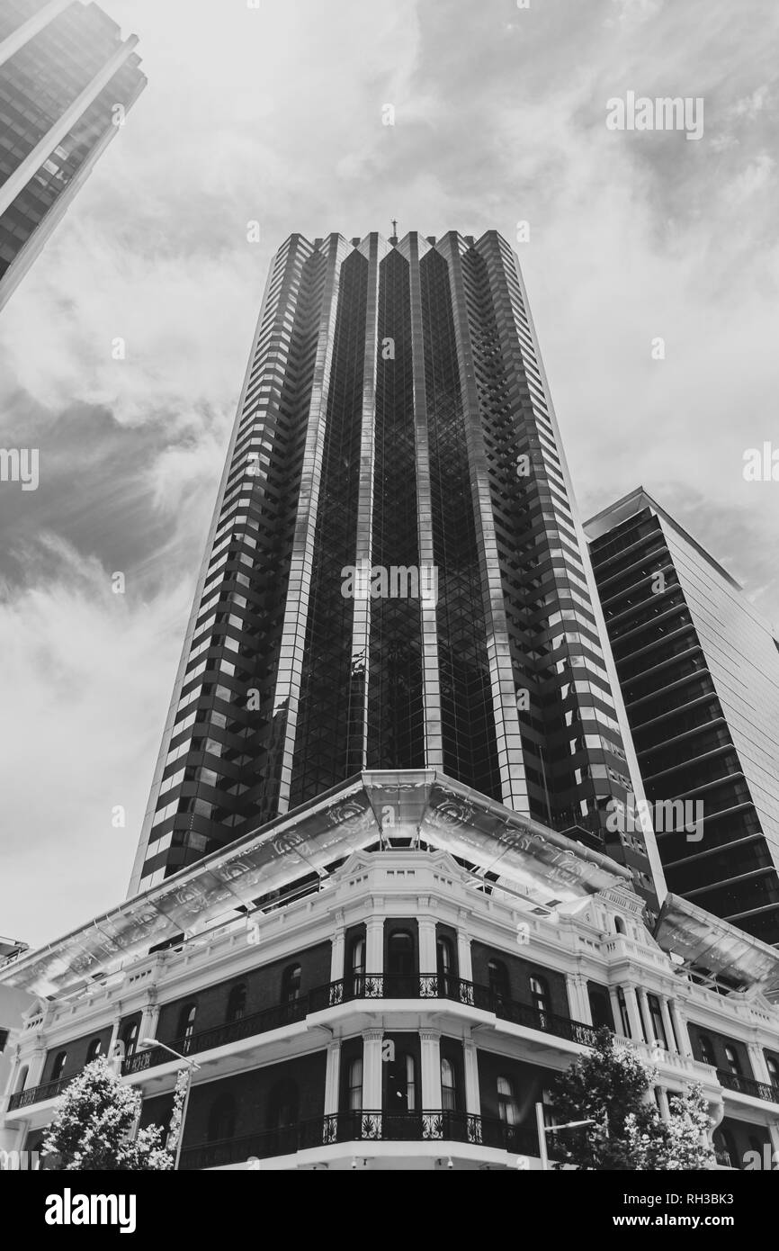 Black and White of old Victorian brick building in front of modern ...
