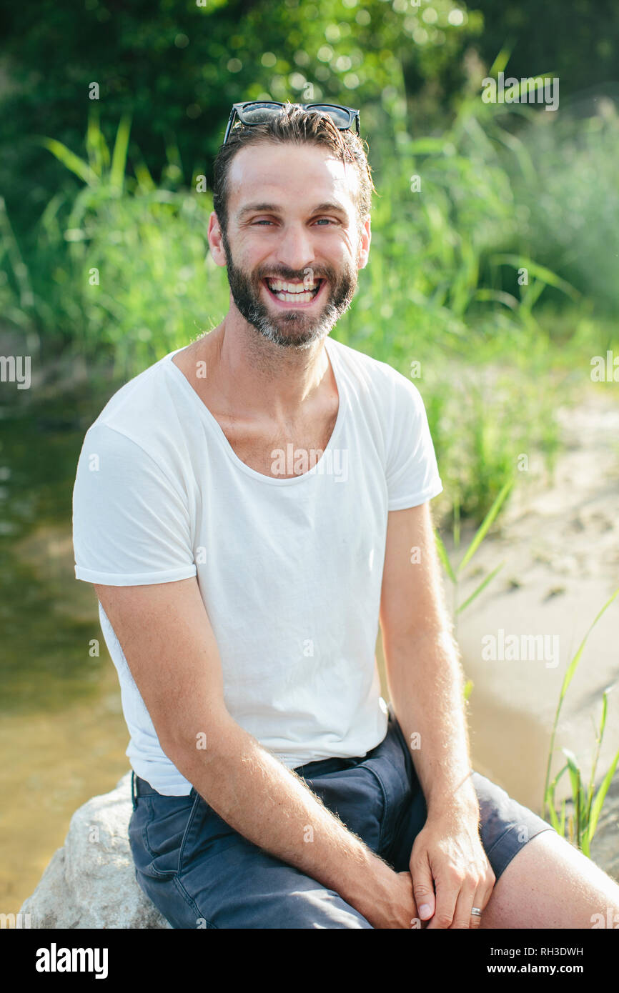 Smiling young man Stock Photo - Alamy